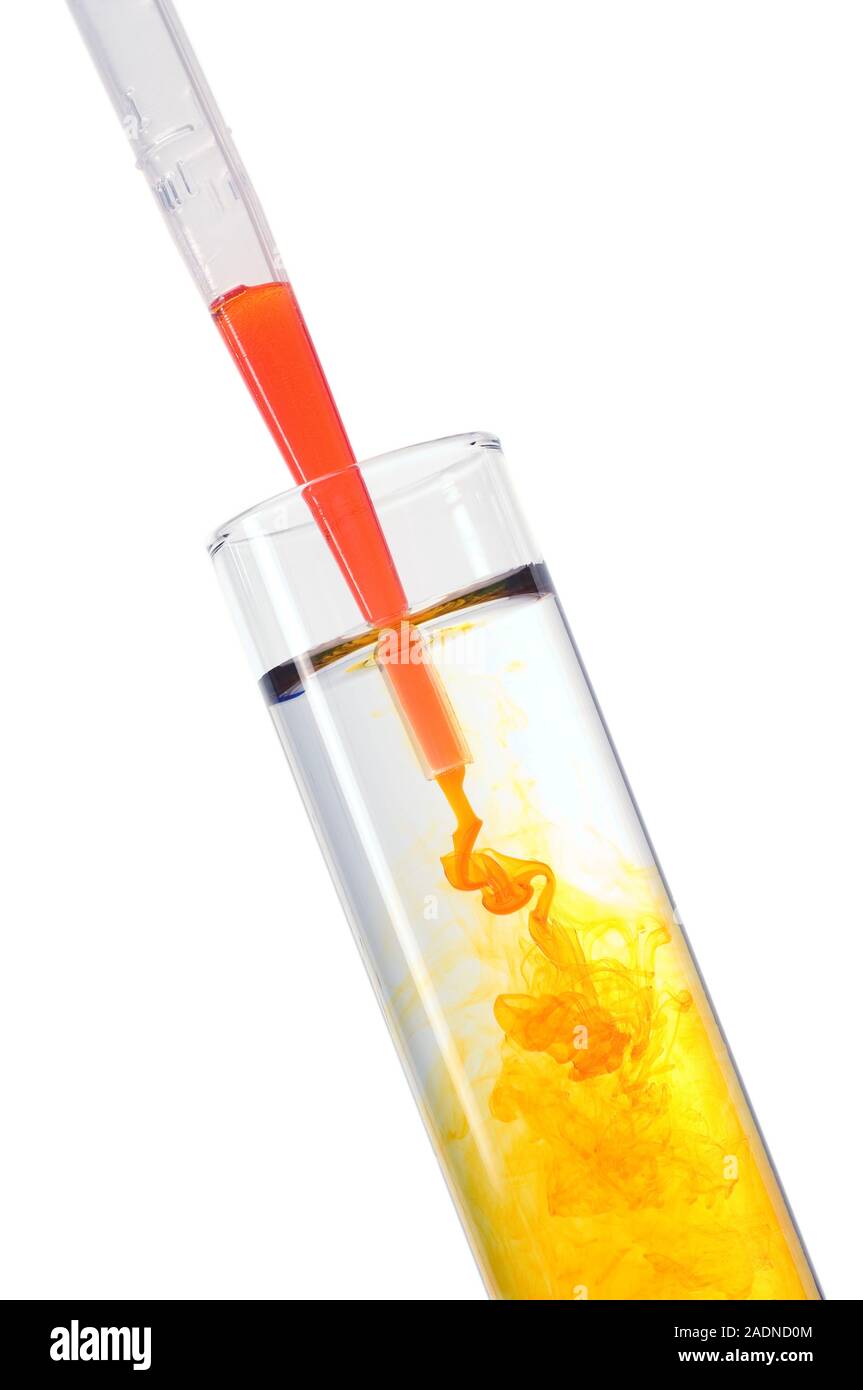 Pipette pouring liquid into a test tube Stock Photo - Alamy