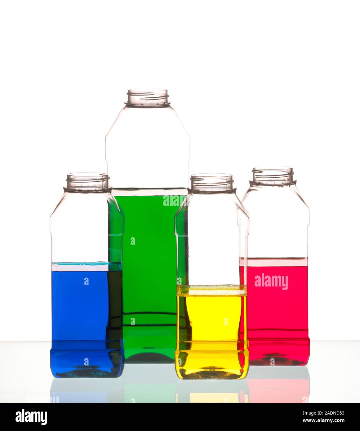 Coloured liquids in plastic laboratory containers Stock Photo - Alamy