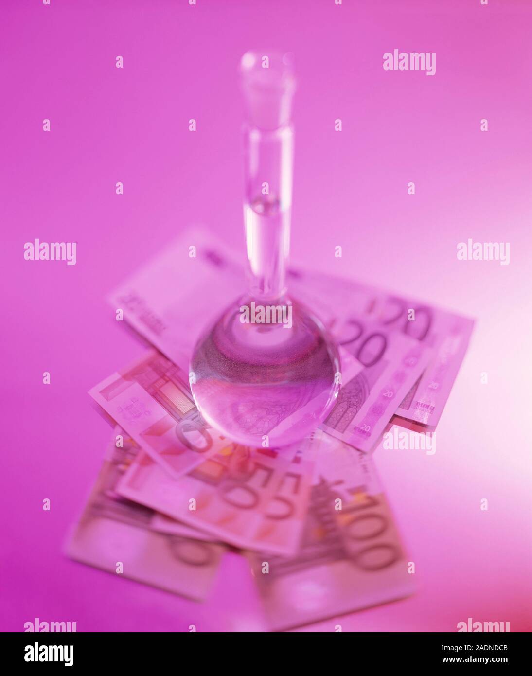 Pharmaceutical profits. Conceptual image of a volumetric flask (a piece ...