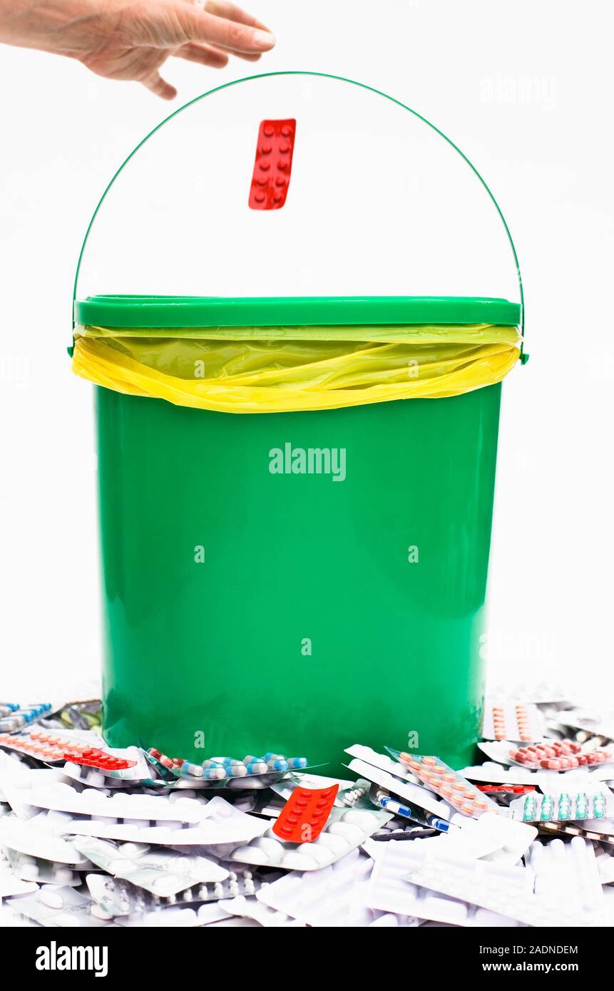 Pharmaceutical waste bucket. Medical worker's hand placing pill ...
