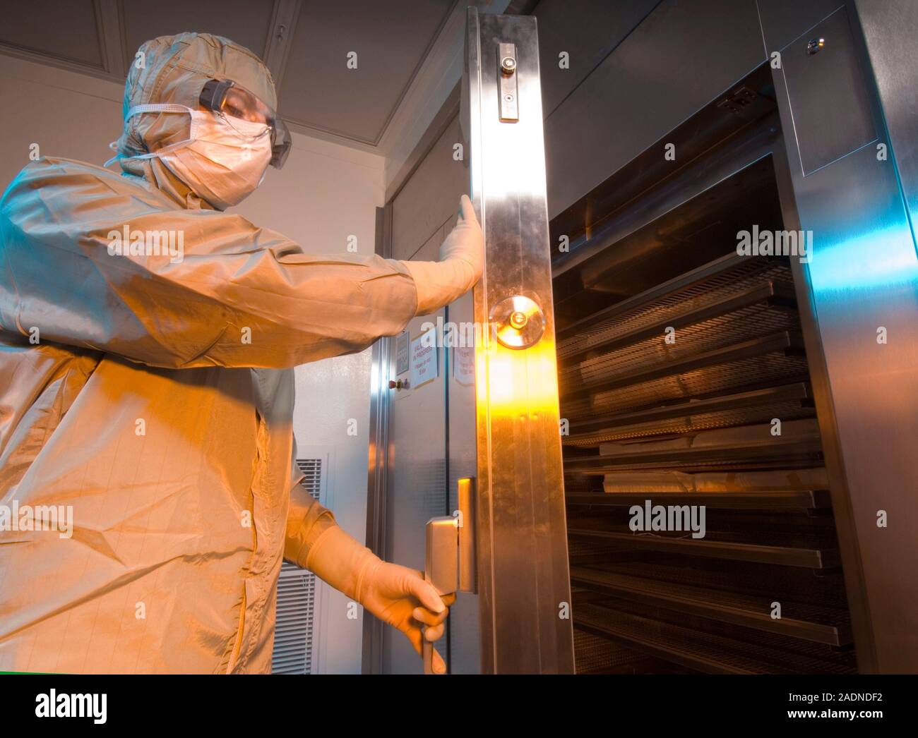 Medical clean room. Clean room worker in full protective clothing ...