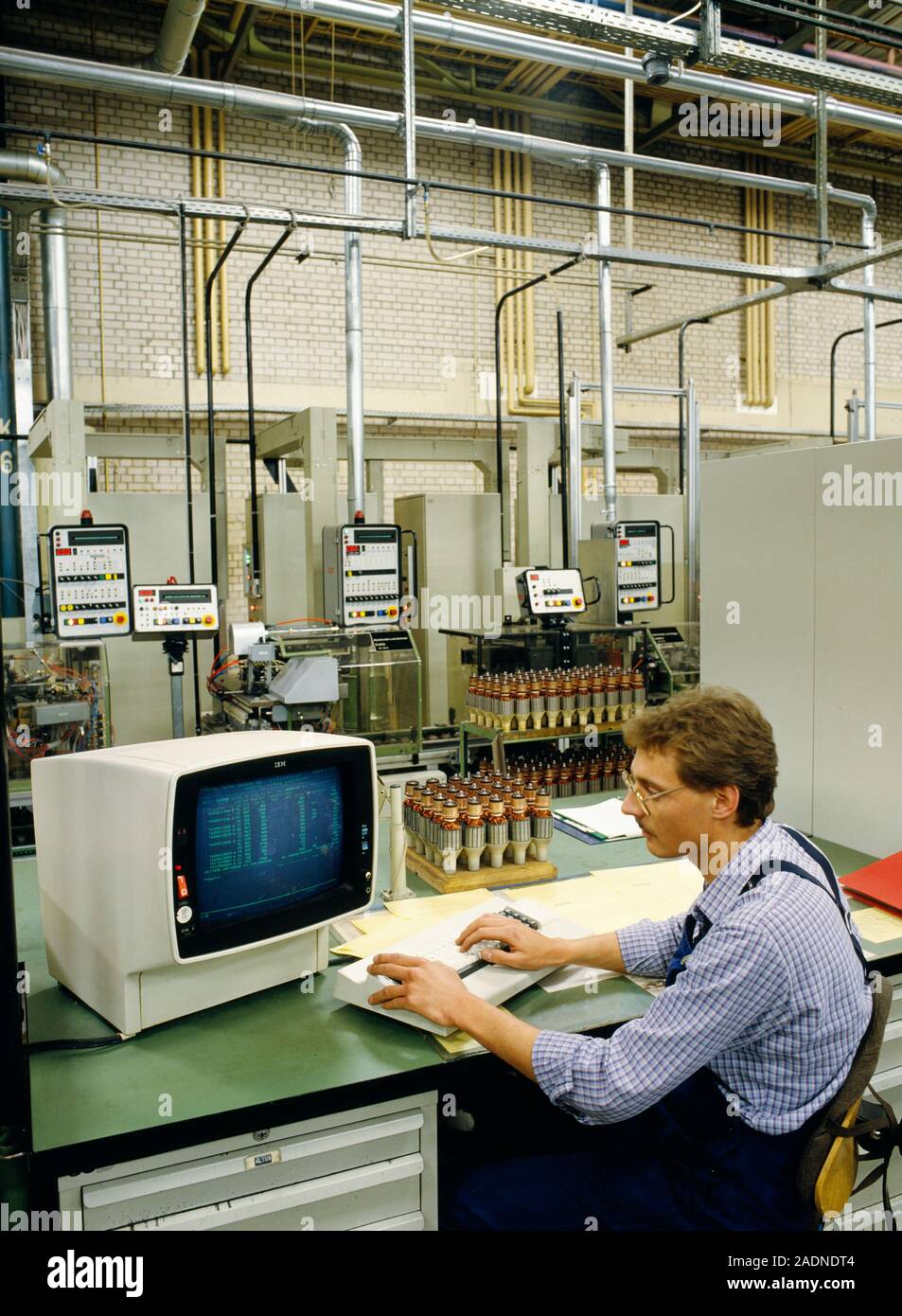 Automated machinery computer. Foreman working at a computer that ...