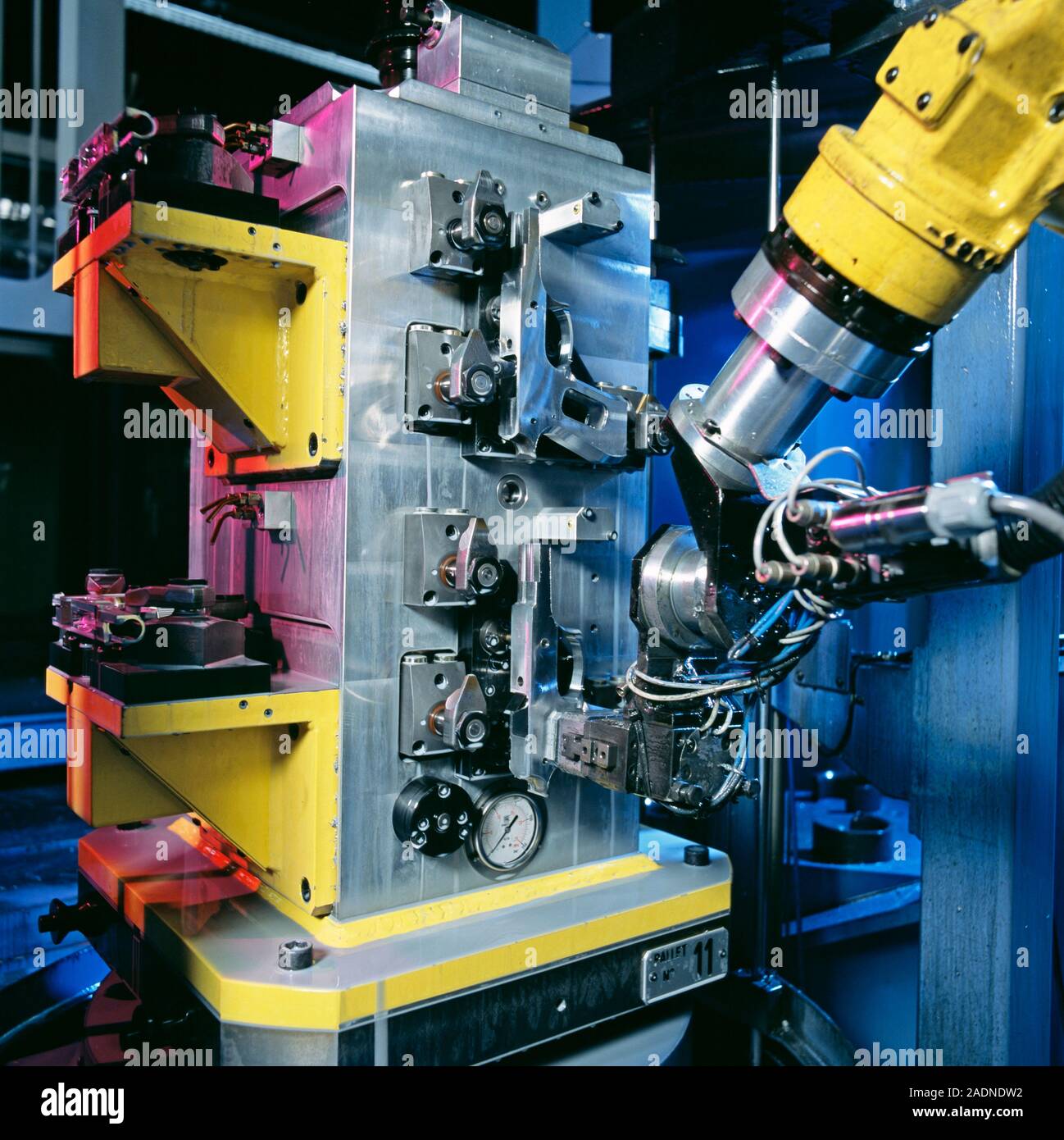 Gun manufacture. Computer-controlled robot used to manufacture the ...