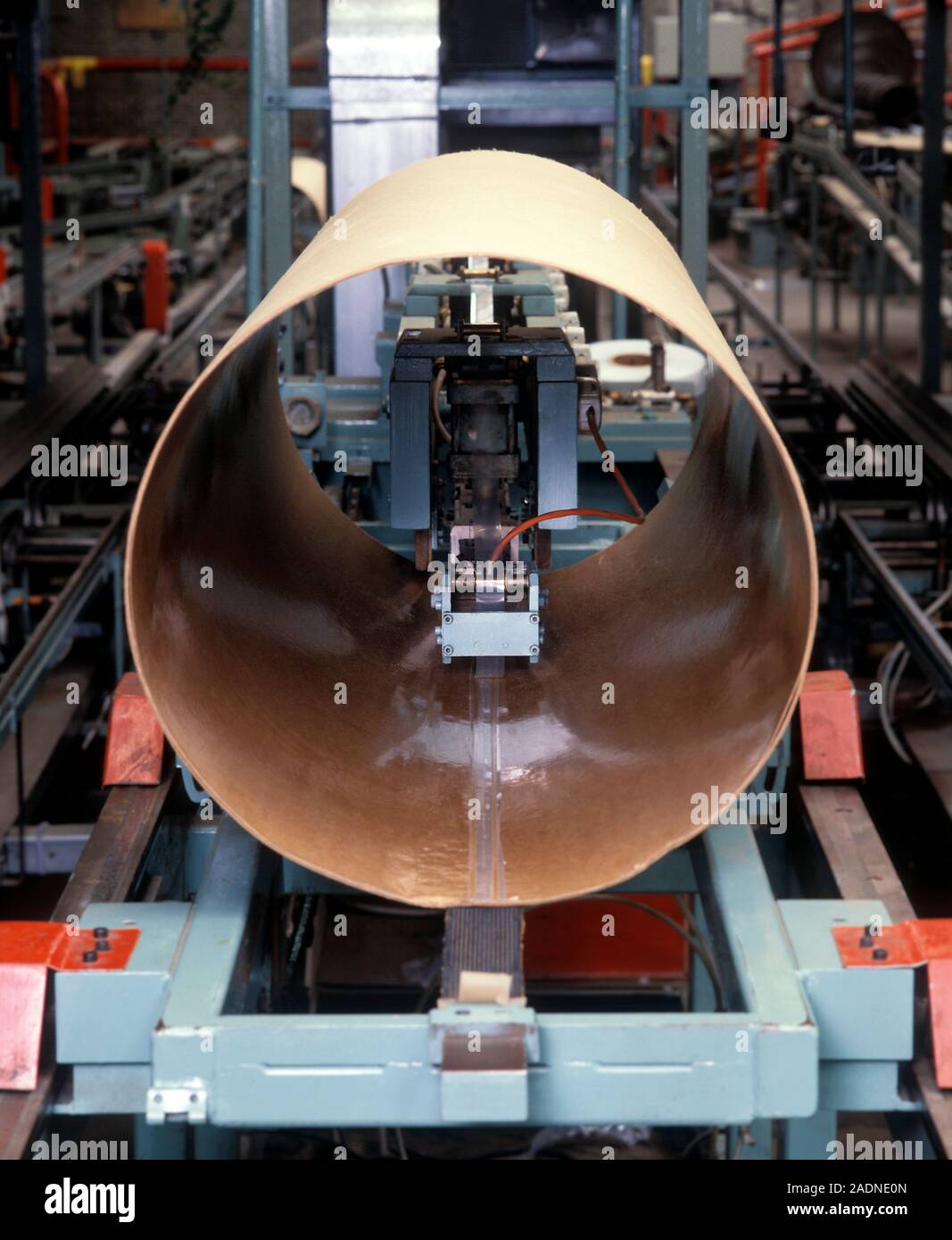 Welding metal barrel. Machine being used to weld a metal barrel at a ...