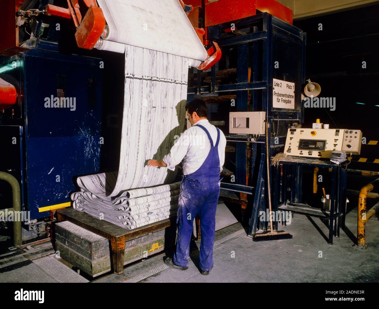 Rubber manufacture. Worker in a rubber manufacturing plant. The worker ...