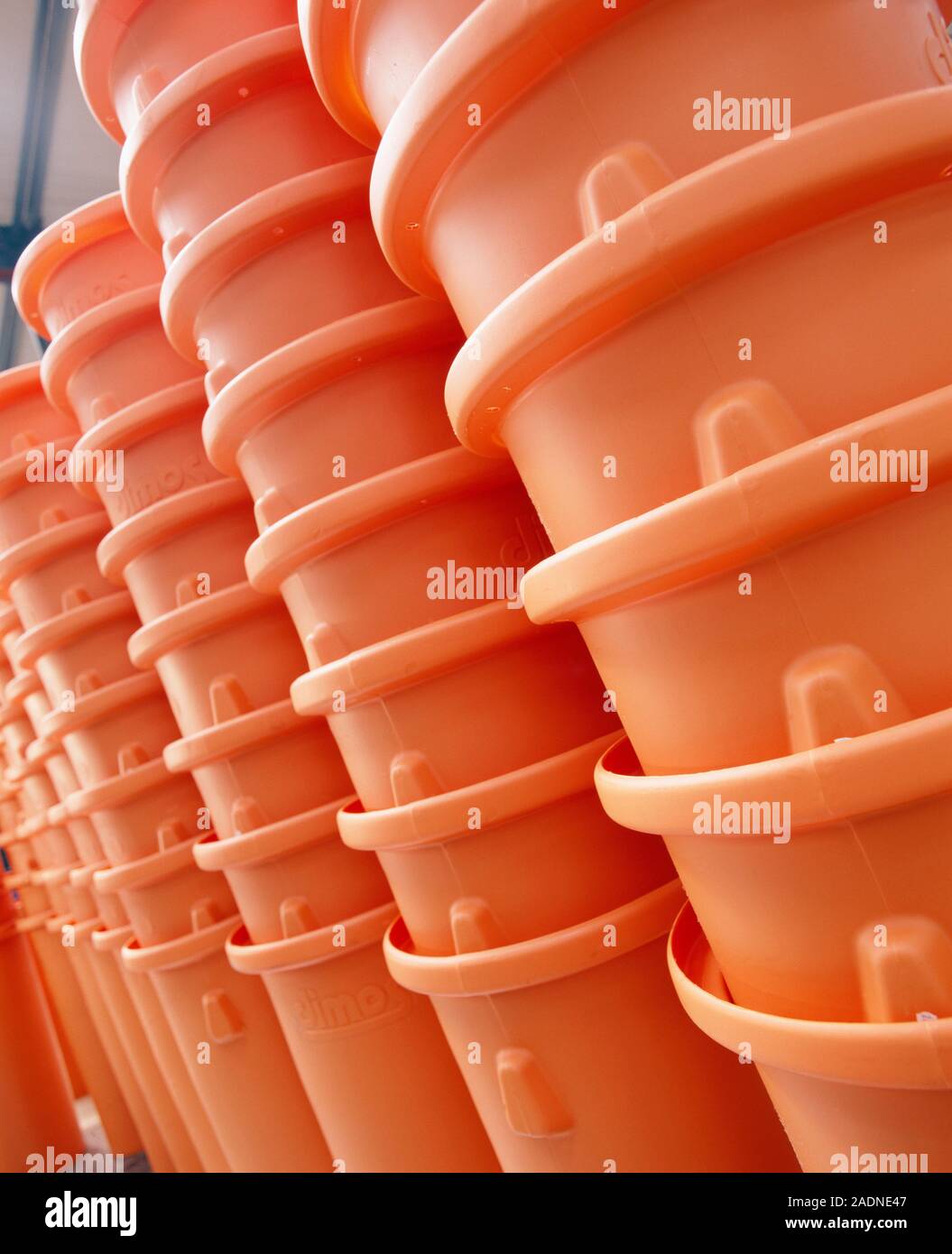 Plastic bins. Row of manufactured plastic bins in the plastics industry ...
