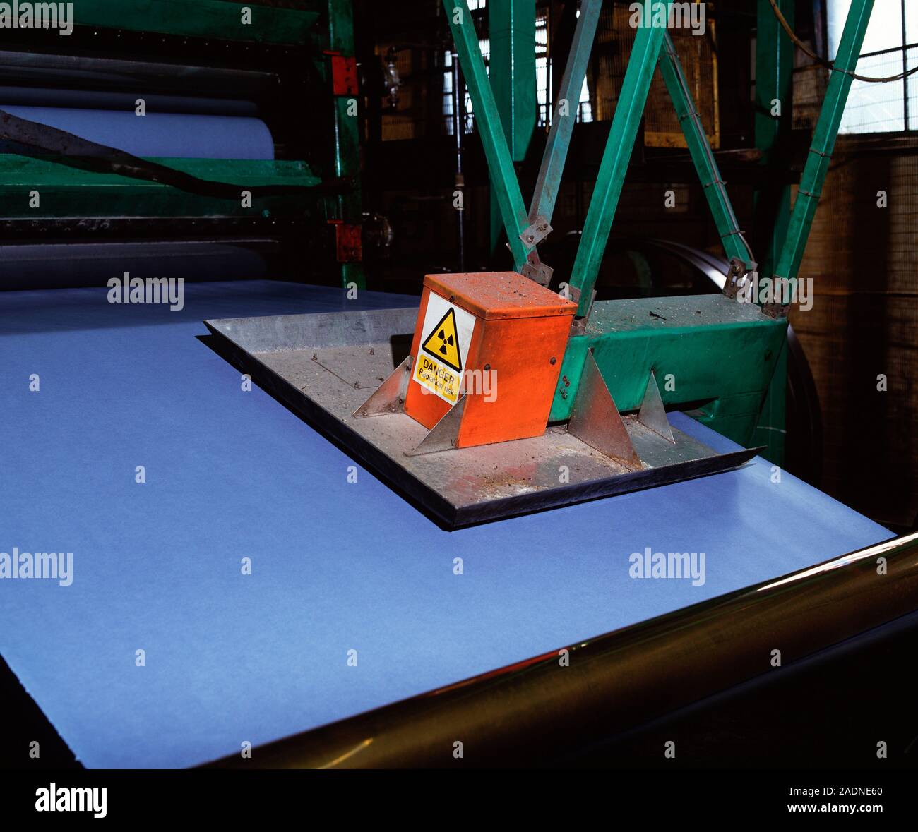 Paper thickness gauge. This device uses a radioactive source to monitor ...