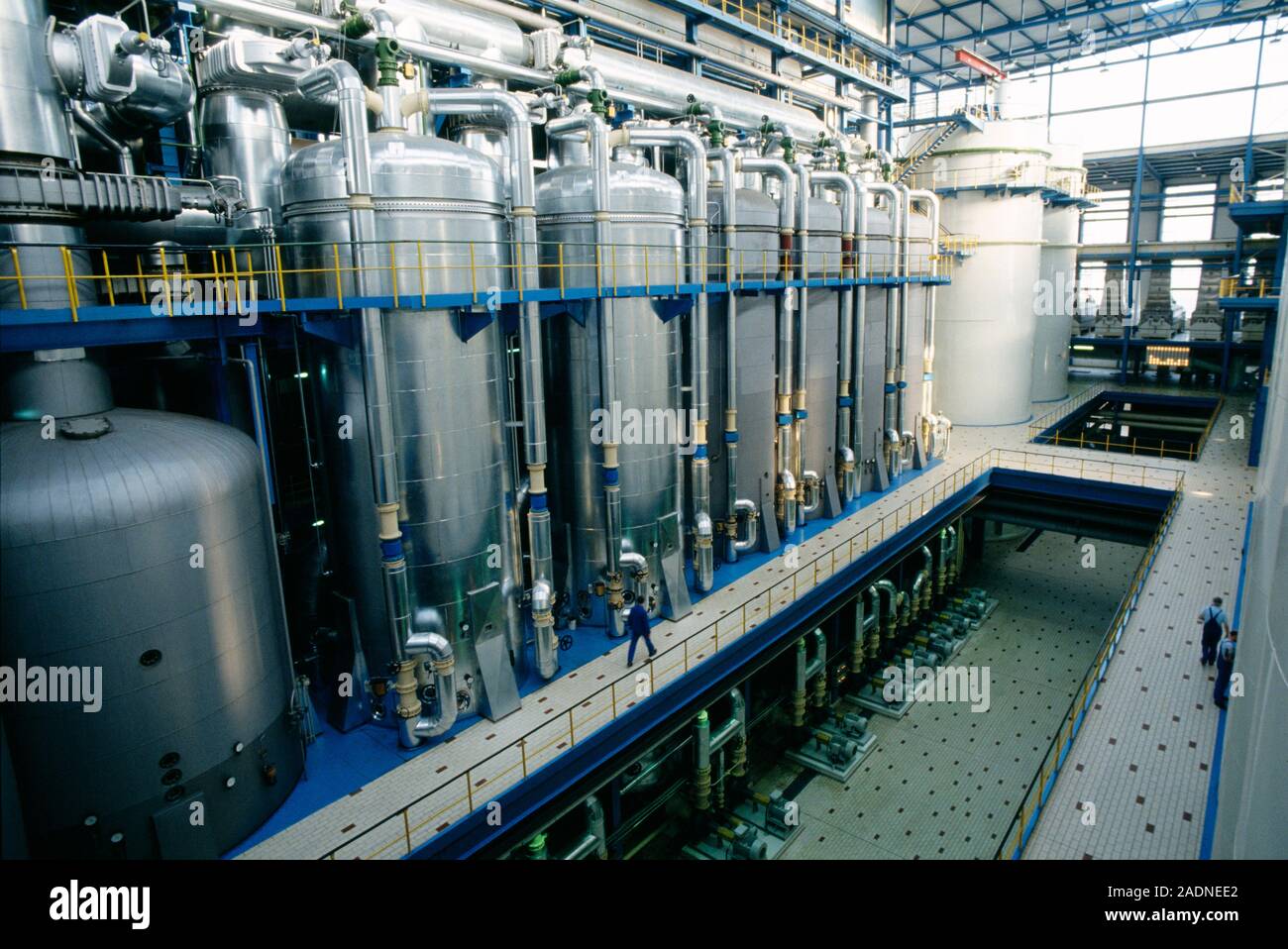 Sugar factory. Boiling machines used to boil sugar cane juice down to a concentrated syrup and ...