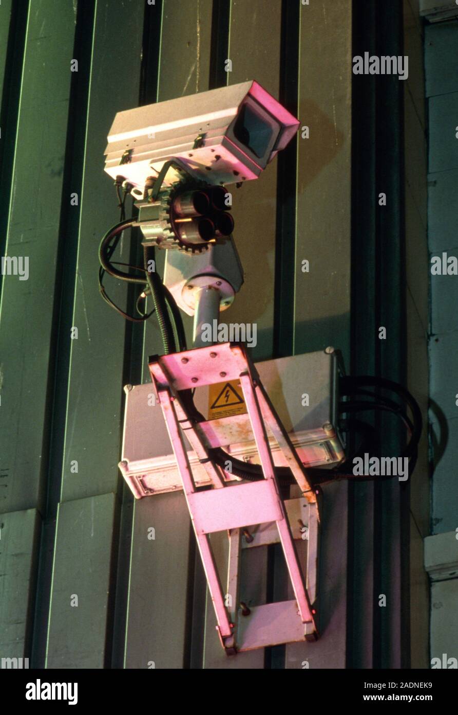 Surveillance video camera mounted on a wall. This Close Circuit ...