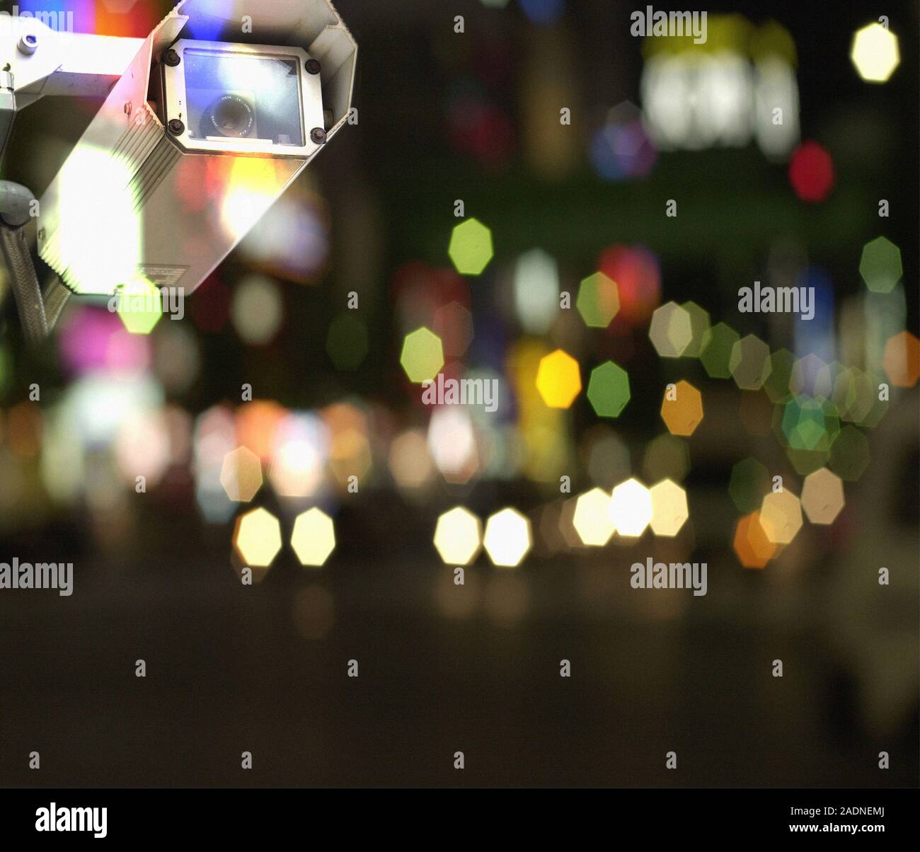 CCTV camera (top left) with blurred city lights. CCTV (Closed-Circuit ...