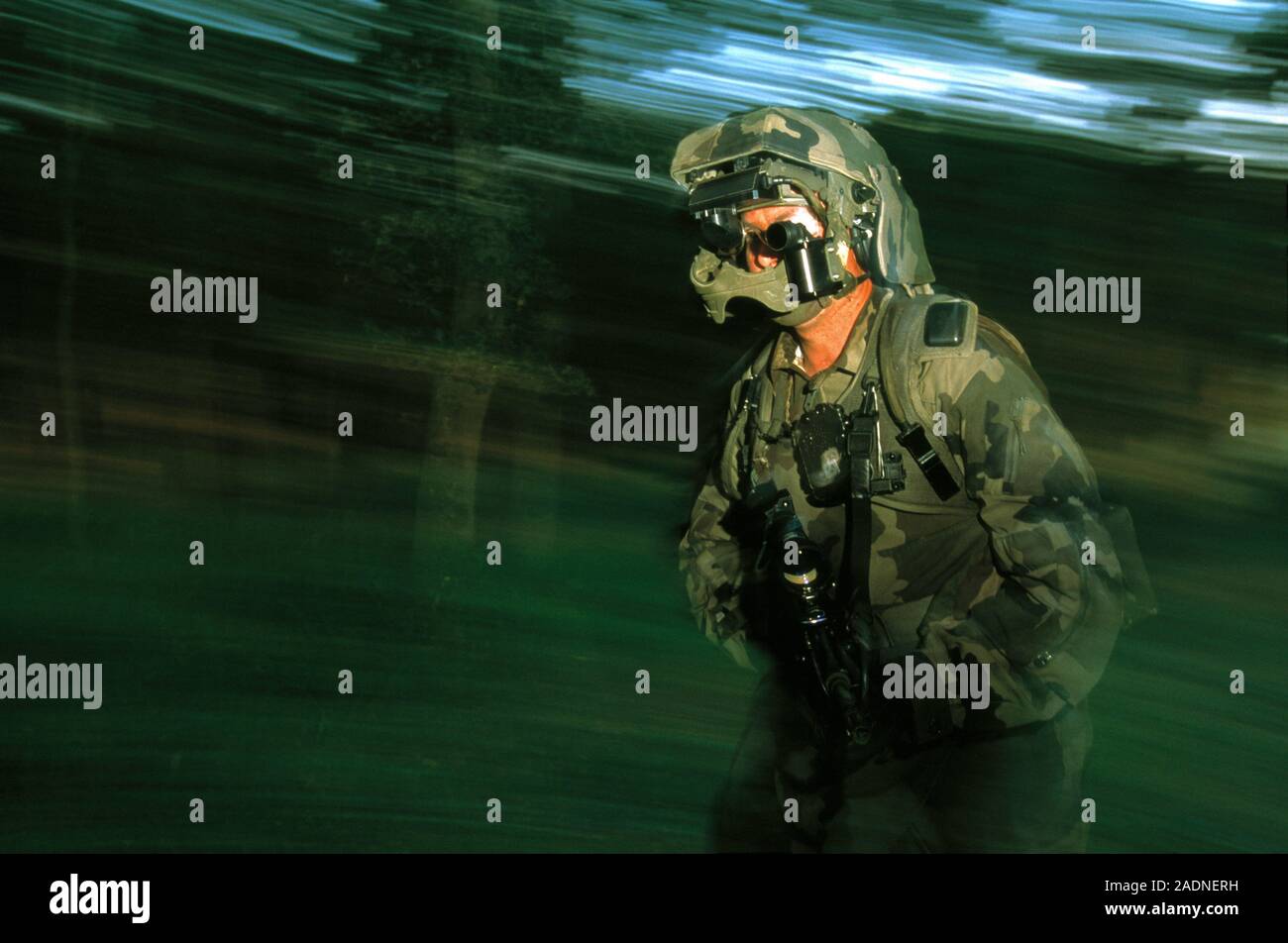 Testing military equipment. Soldier running while equipped with the ...