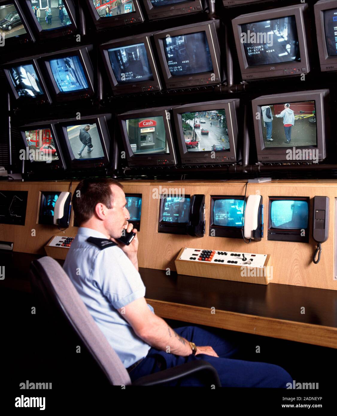 Security control room. Security guard sitting in a control room ...