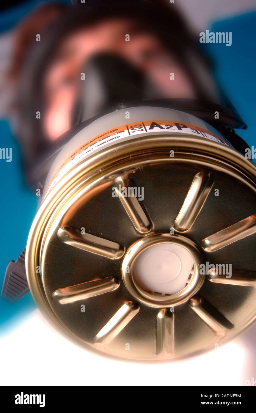 MODEL RELEASED. Gas mask. Close-up of the canister of a gas mask being ...