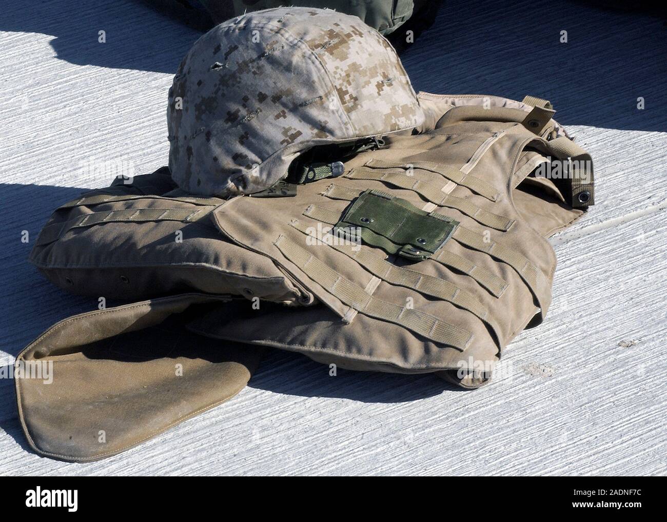 Military clothing. US Army flack jacket and Kevlar helmet. Kevlar can ...