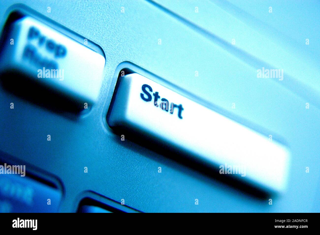 Start button on a machine Stock Photo - Alamy