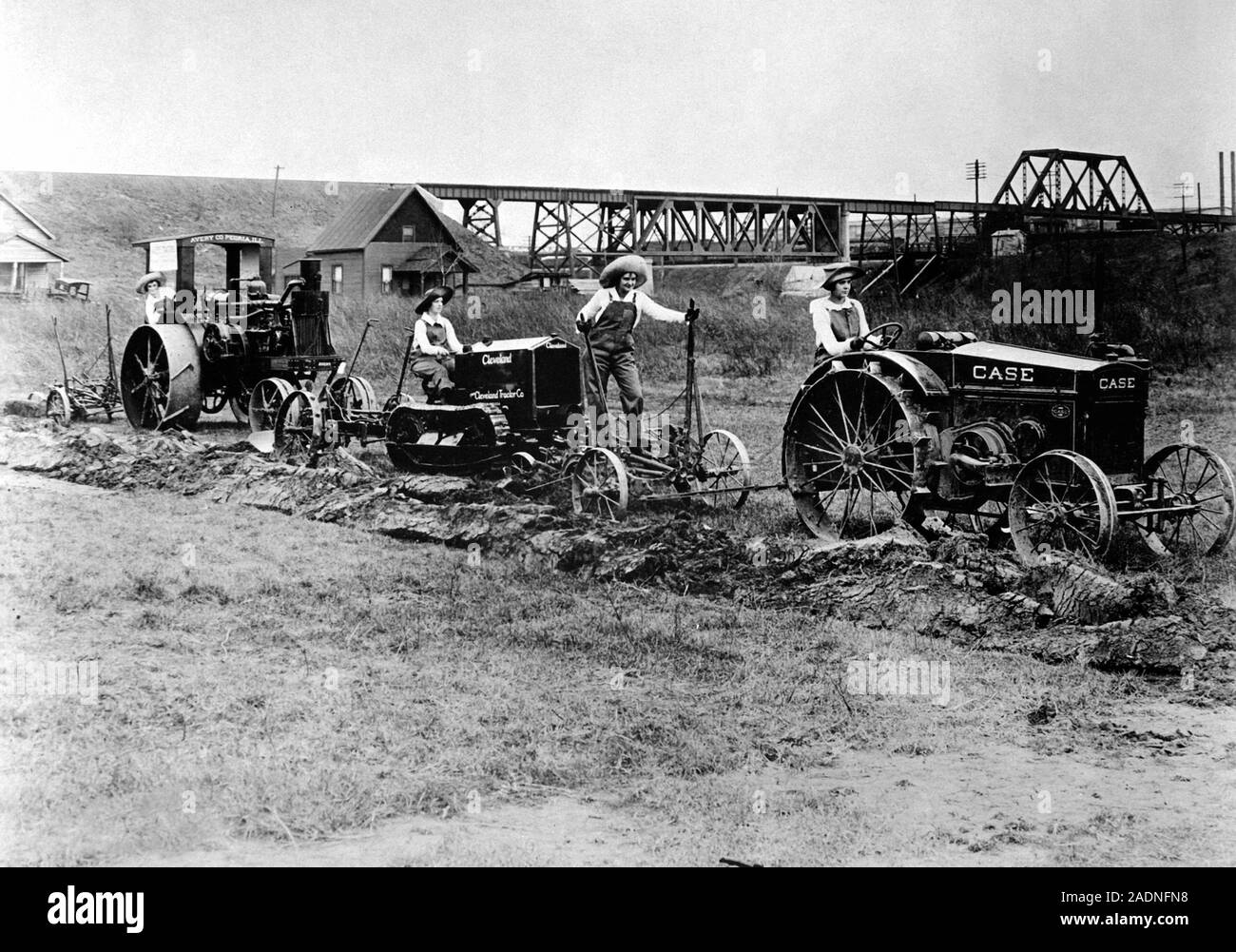 First World War farm workers. Female farm workers guiding tractors to ...