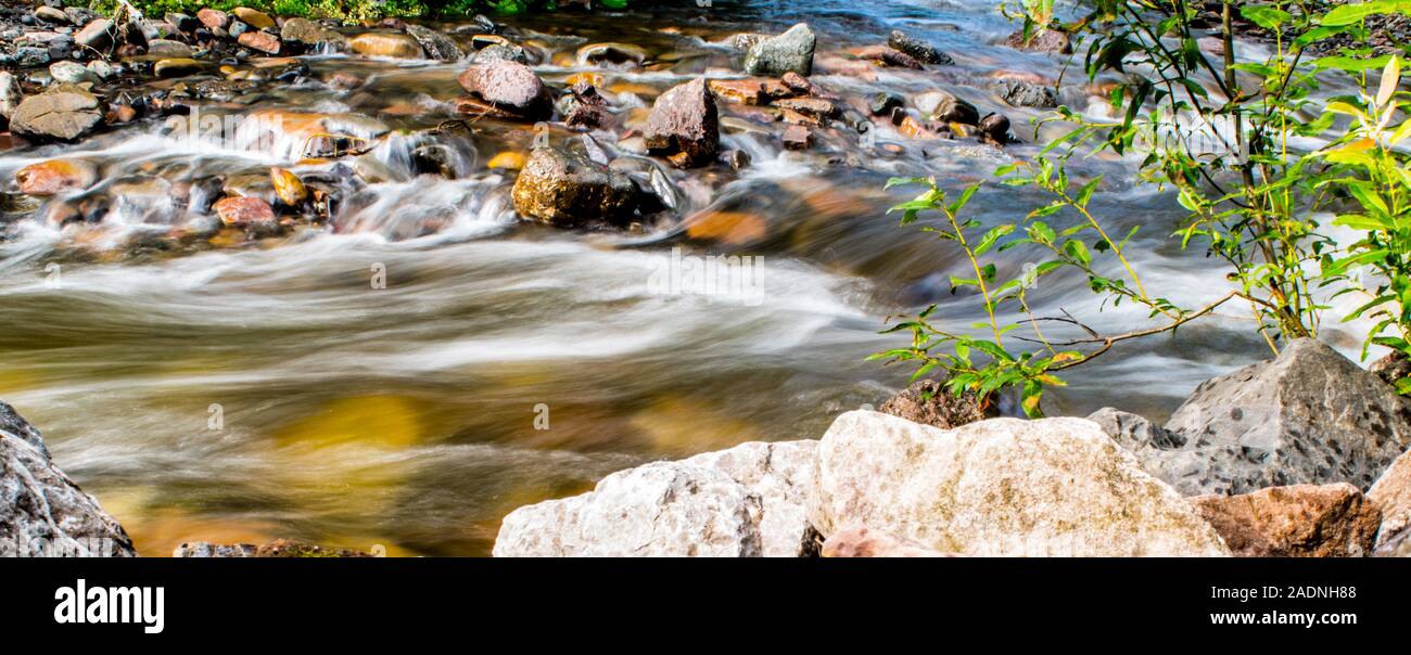 Pebbles in stream hi-res stock photography and images - Alamy