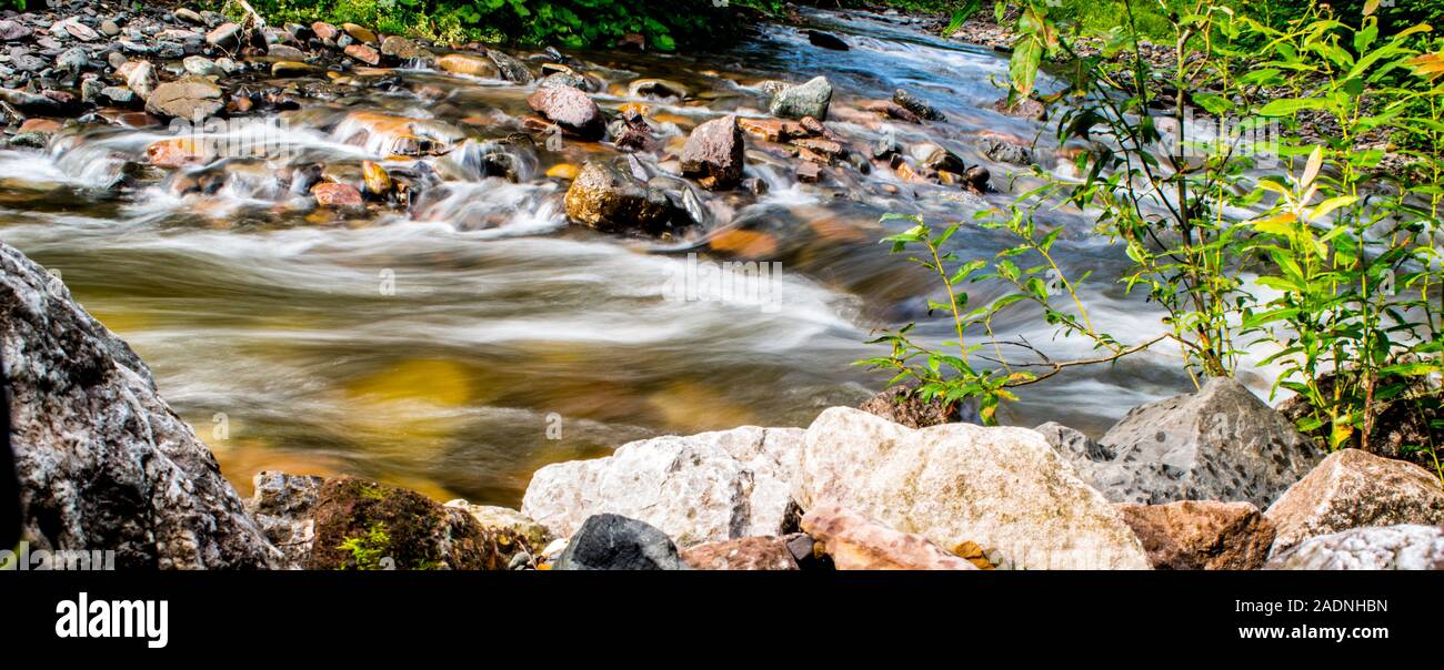 Pebbles in stream hi-res stock photography and images - Alamy