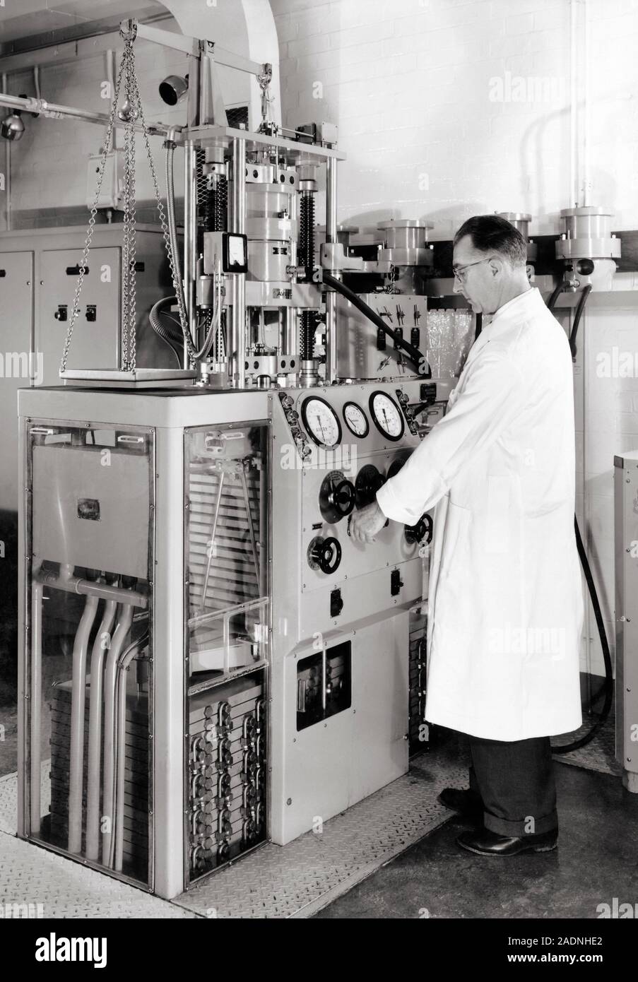 Mass balance. Researcher using a high-precision mass balance in a ...