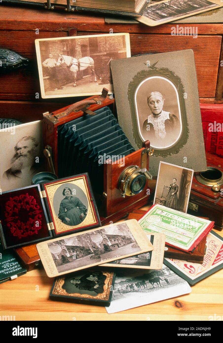 Early camera. Bellows-type camera from about 1885 with a collection of ...