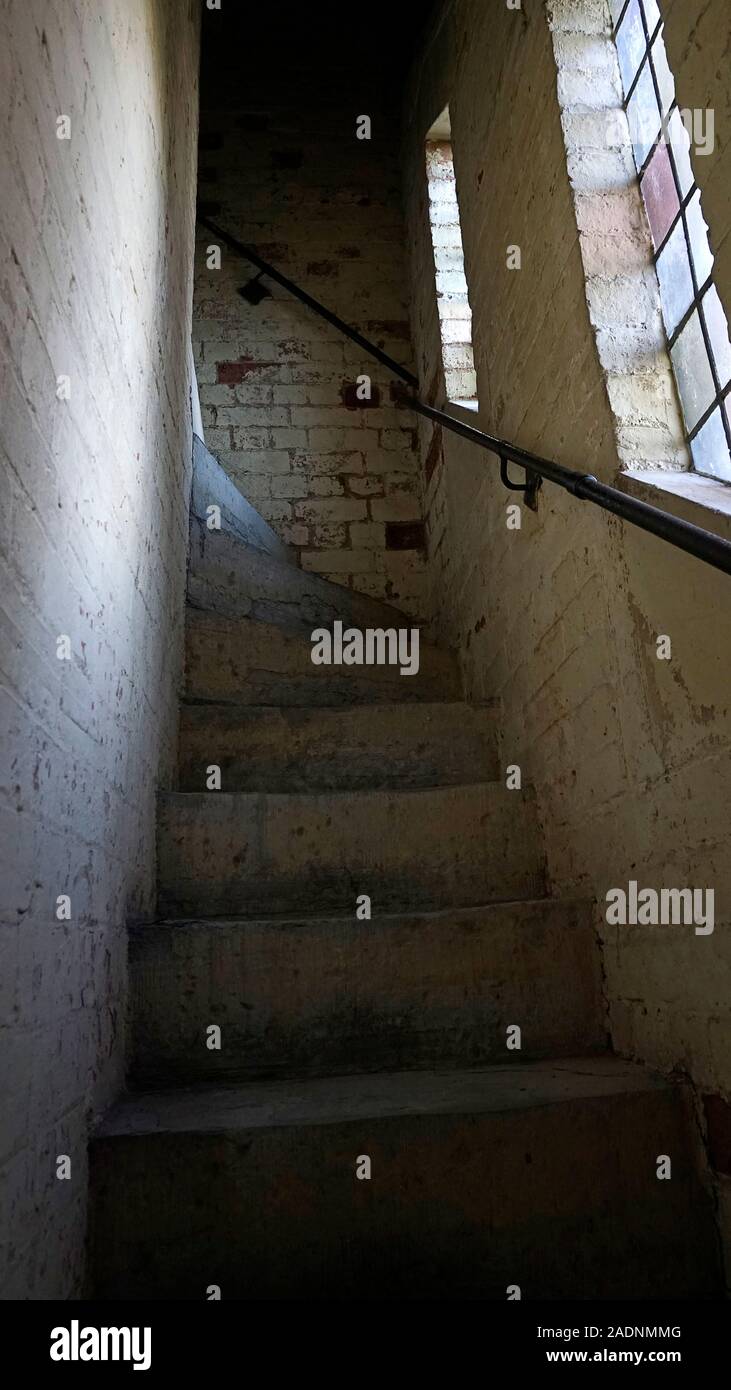 A dark narrow staircase leading to a church tower Stock Photo - Alamy