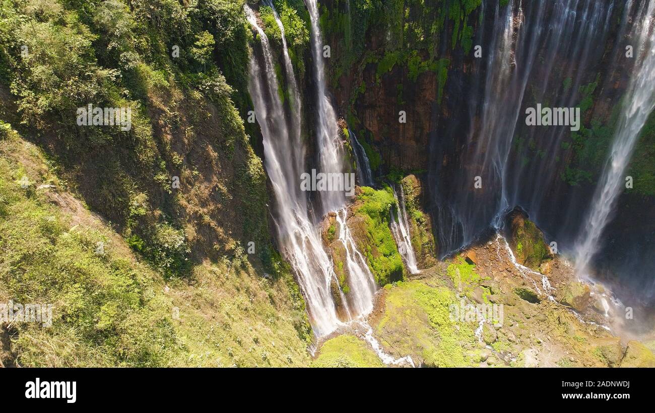 beautiful waterfall Coban Sewu in tropical forest, Java Indonesia ...