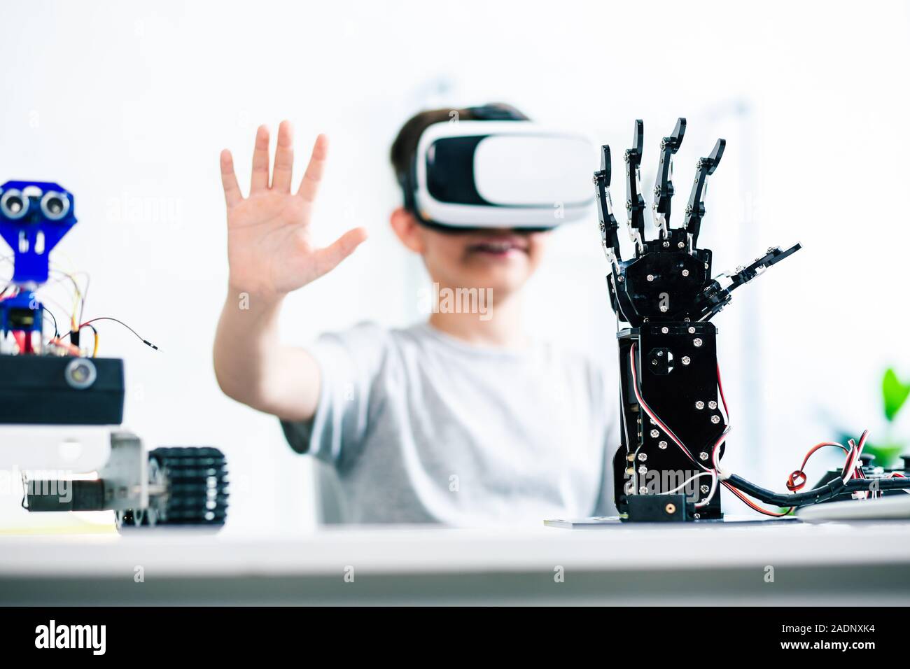 Close up of robotic humanoid hand standing on the table Stock Photo - Alamy