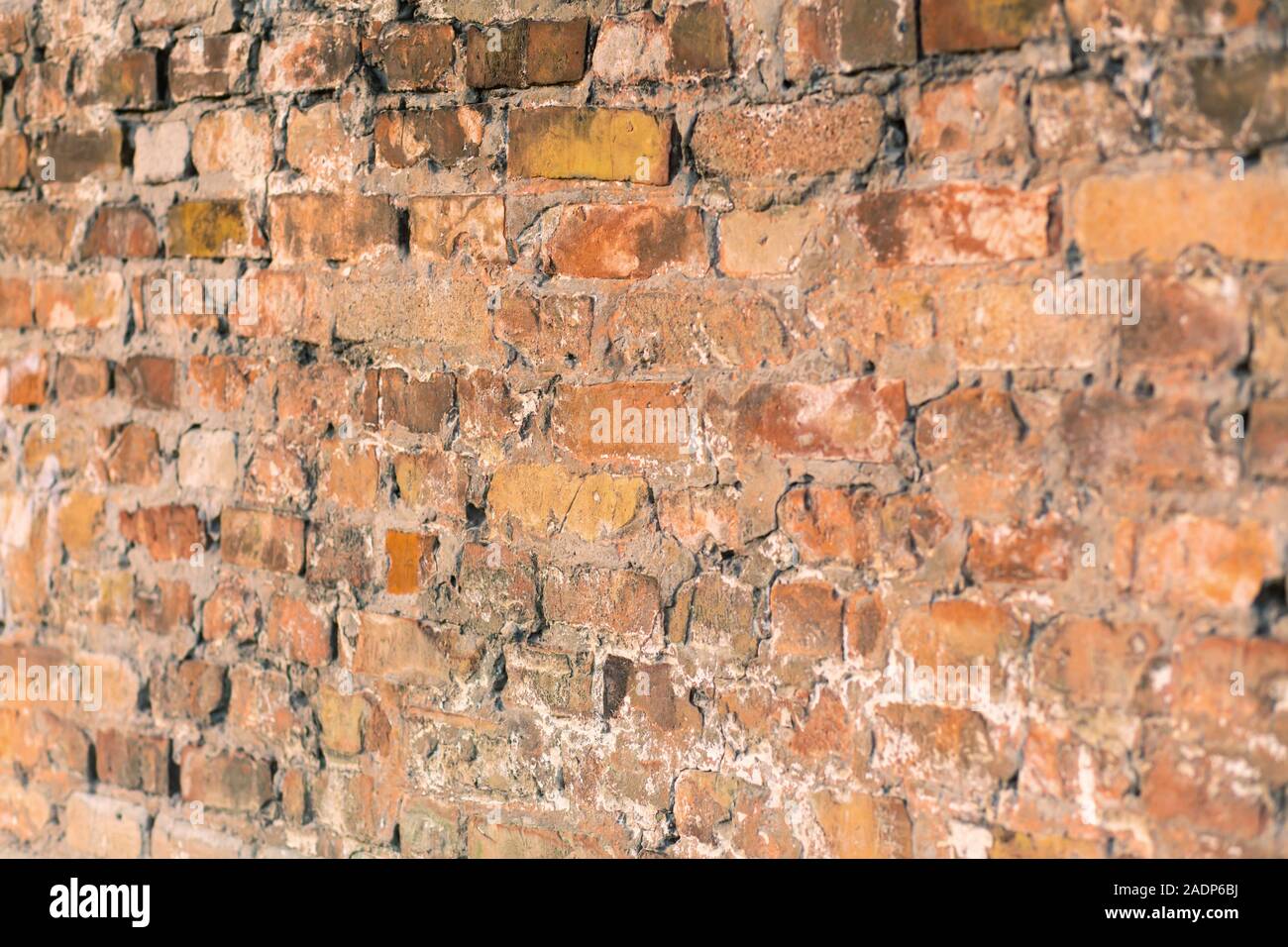 old red brick falling apart wall texture background Stock Photo - Alamy