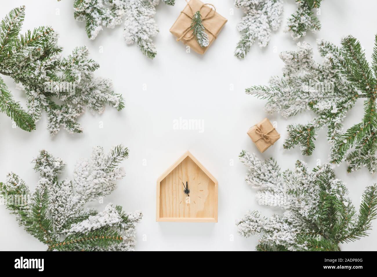 Christmas and New Year still life. Wooden clock shows five minutes to ...