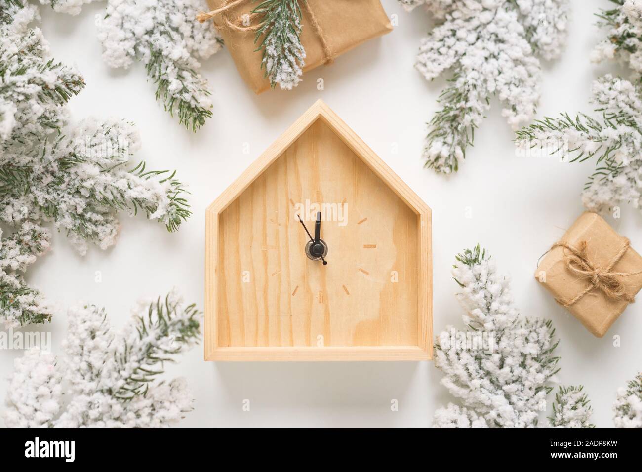Christmas and New Year still life. Wooden clock shows five minutes to ...