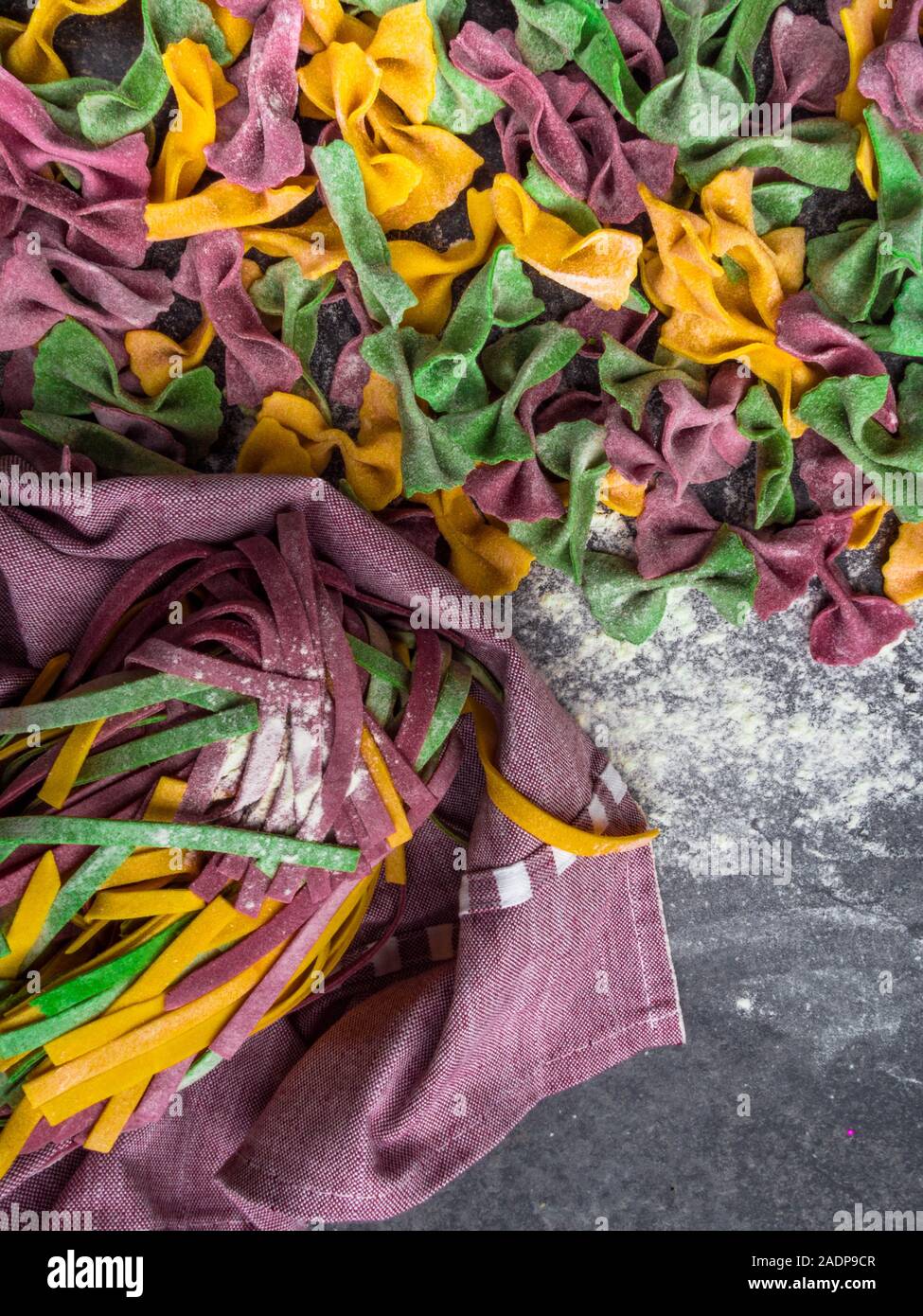 Variety of raw pasta types, farfalle bow-tie, fettuccine or tagliatelle ...