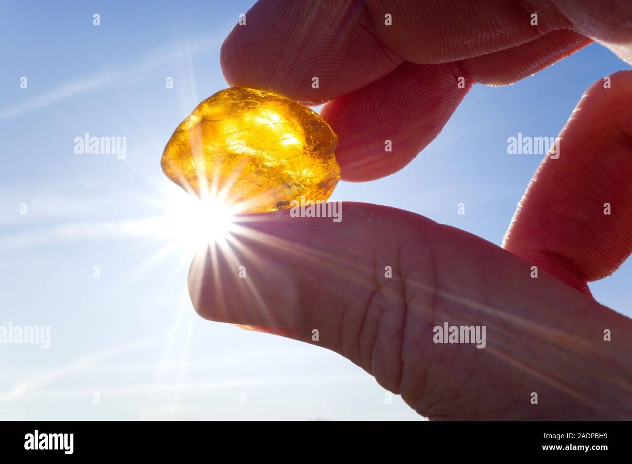 Hand and amber hi-res stock photography and images - Alamy
