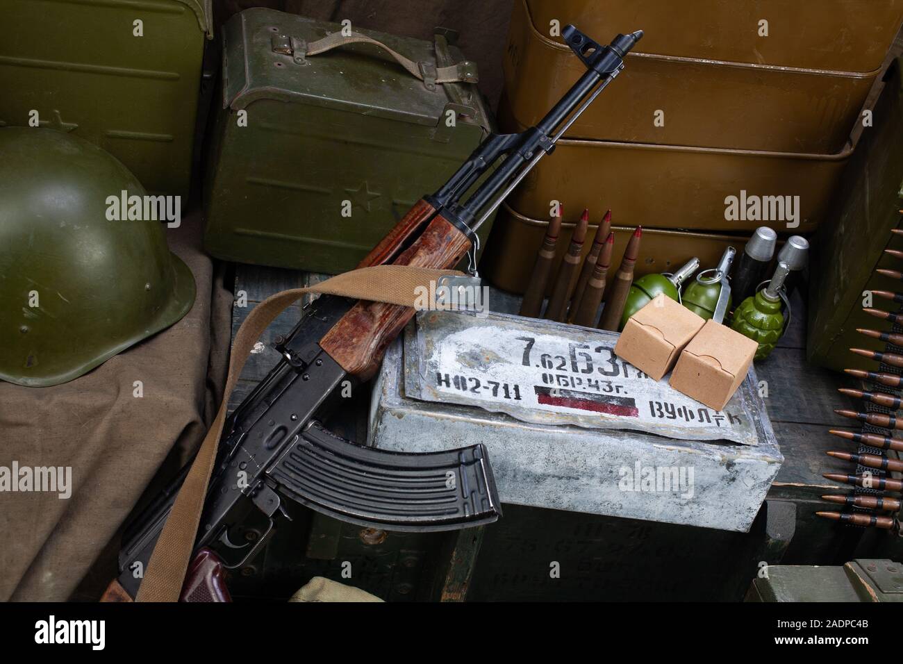 Kalashnikov AK 47 with ammunitions on army green box background. Text ...