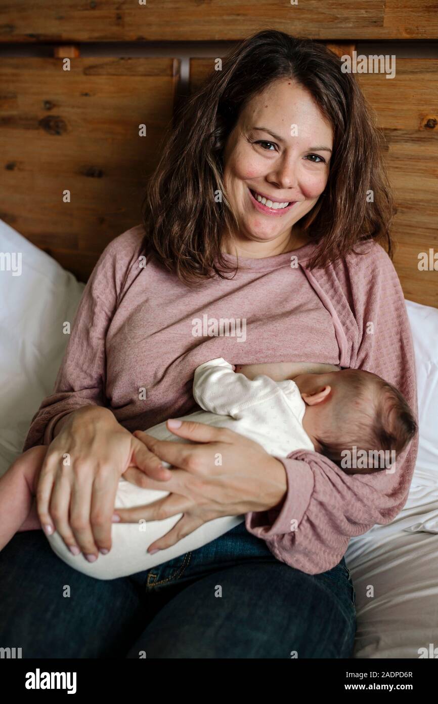 Woman breastfeeding her baby hi-res stock photography and images - Alamy