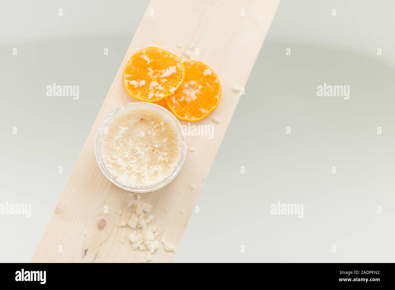 orange bath scene with body scrub and bath water Stock Photo - Alamy