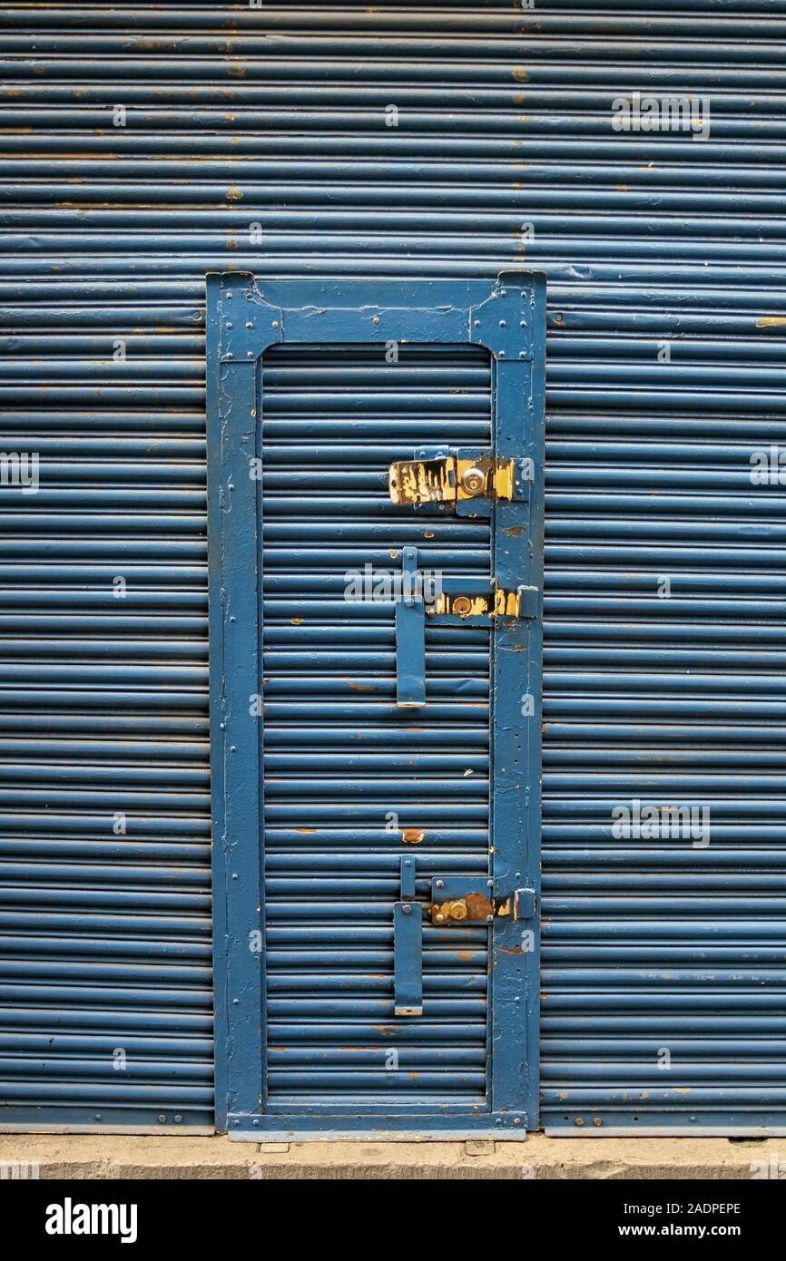 A blue iron gate in Mexico Stock Photo - Alamy