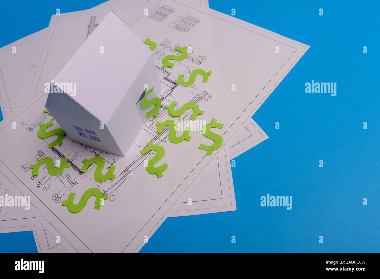 Paper skyscrapers , us dollar money, house projects plan and blueprints ...