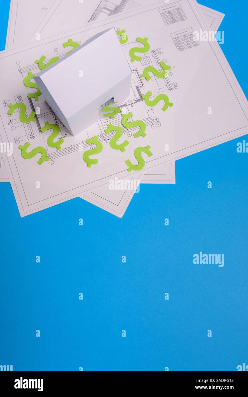 Paper skyscrapers , us dollar money, house projects plan and blueprints ...