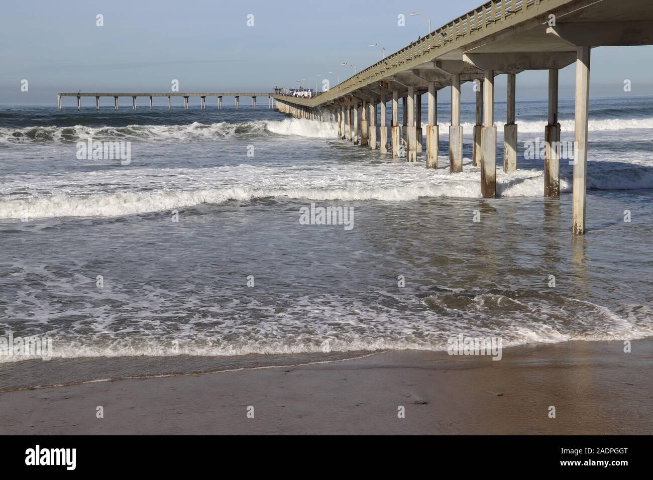 High Tide at Ocean Beach Pier Stock Photo - Alamy