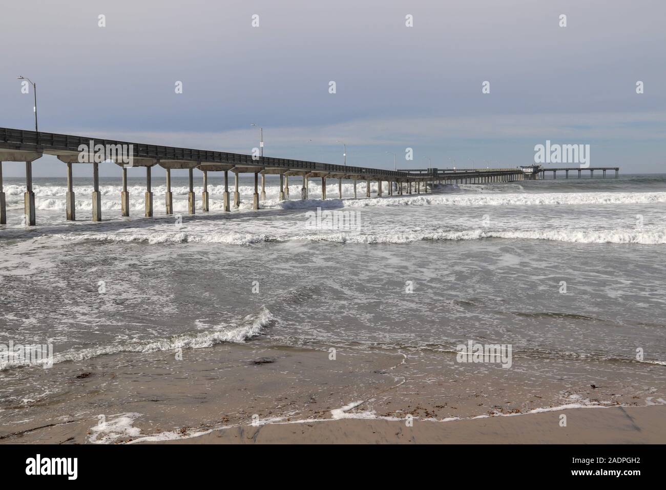 High Tide at Ocean Beach Pier Stock Photo - Alamy