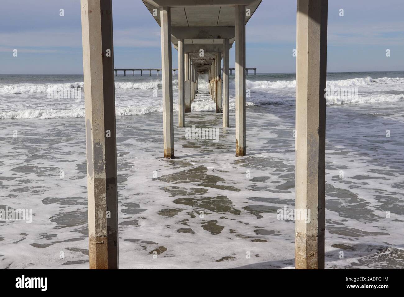 High Tide at Ocean Beach Pier Stock Photo - Alamy
