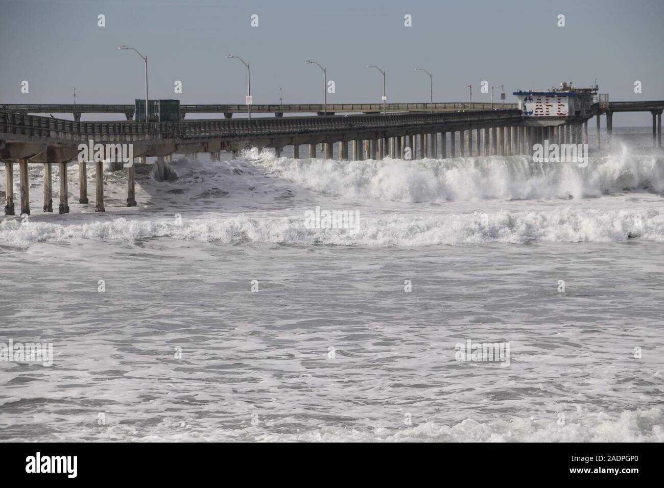 High Tide at Ocean Beach Pier Stock Photo - Alamy