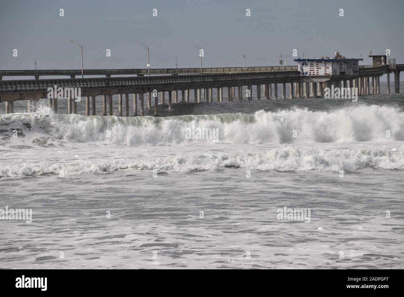High Tide at Ocean Beach Pier Stock Photo - Alamy