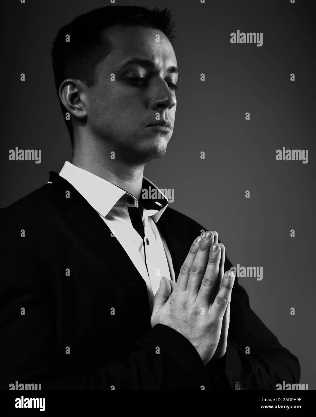 Black Man In Suit Praying