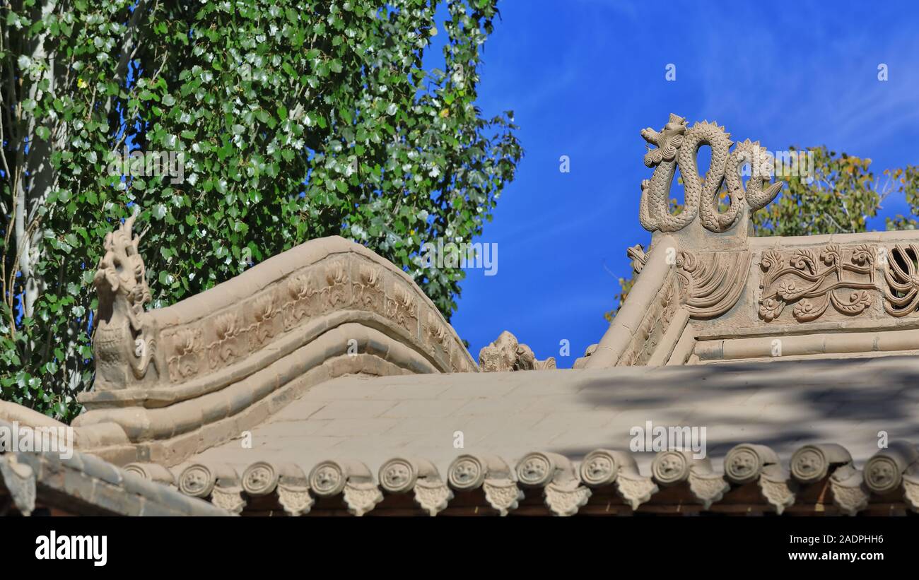 Makaras on glazed tubular tile rooftop. Mogao Buddhist caves-Dunhuang ...