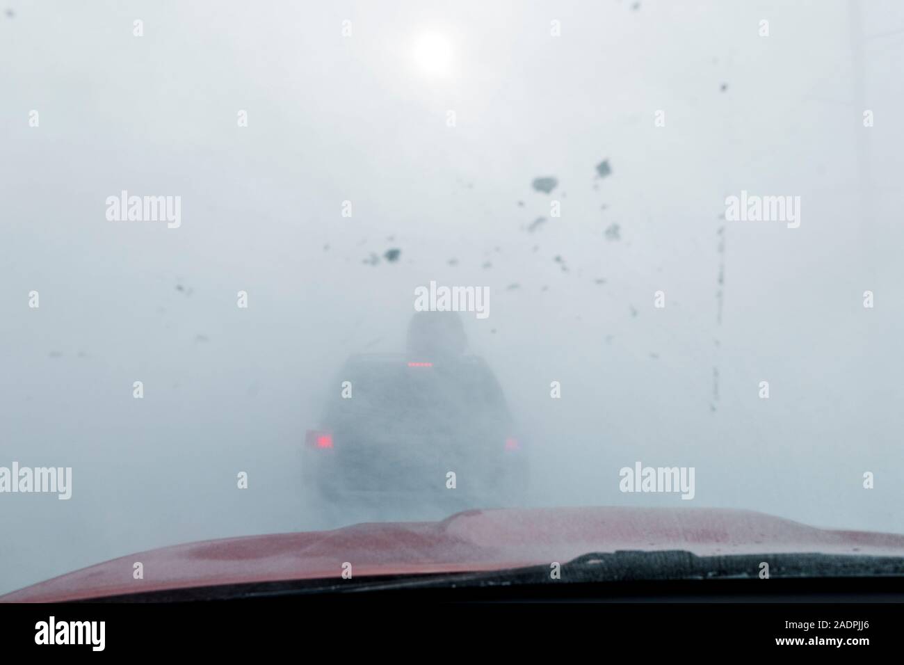 Windshield view of hazardous snow blizzard on highway 285; Park County ...