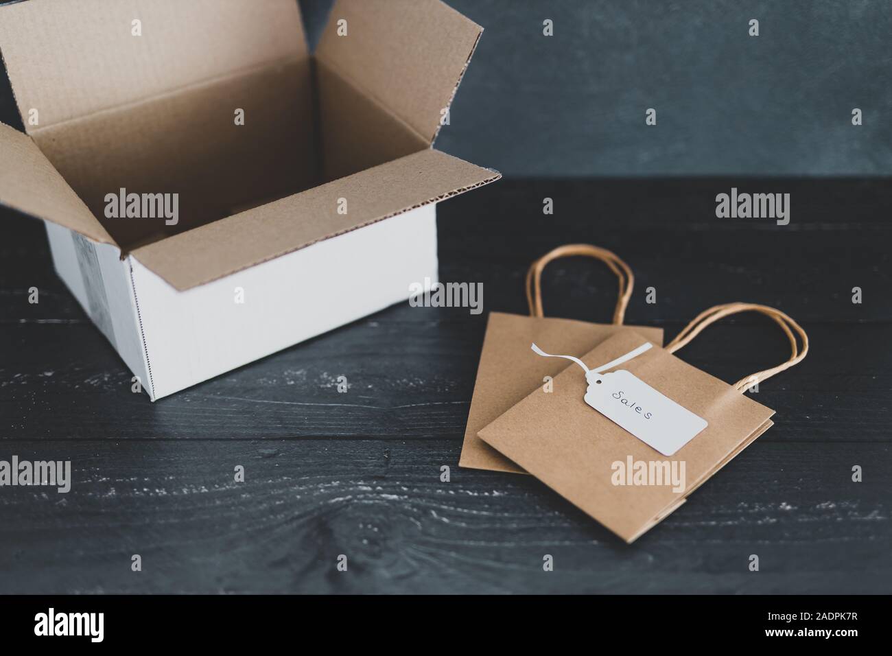 online shopping conceptual still-life, open empty parcel with shopping ...