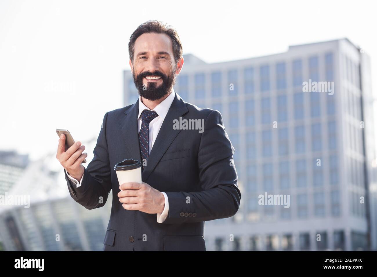 Positive office worker going to work in the morning Stock Photo - Alamy