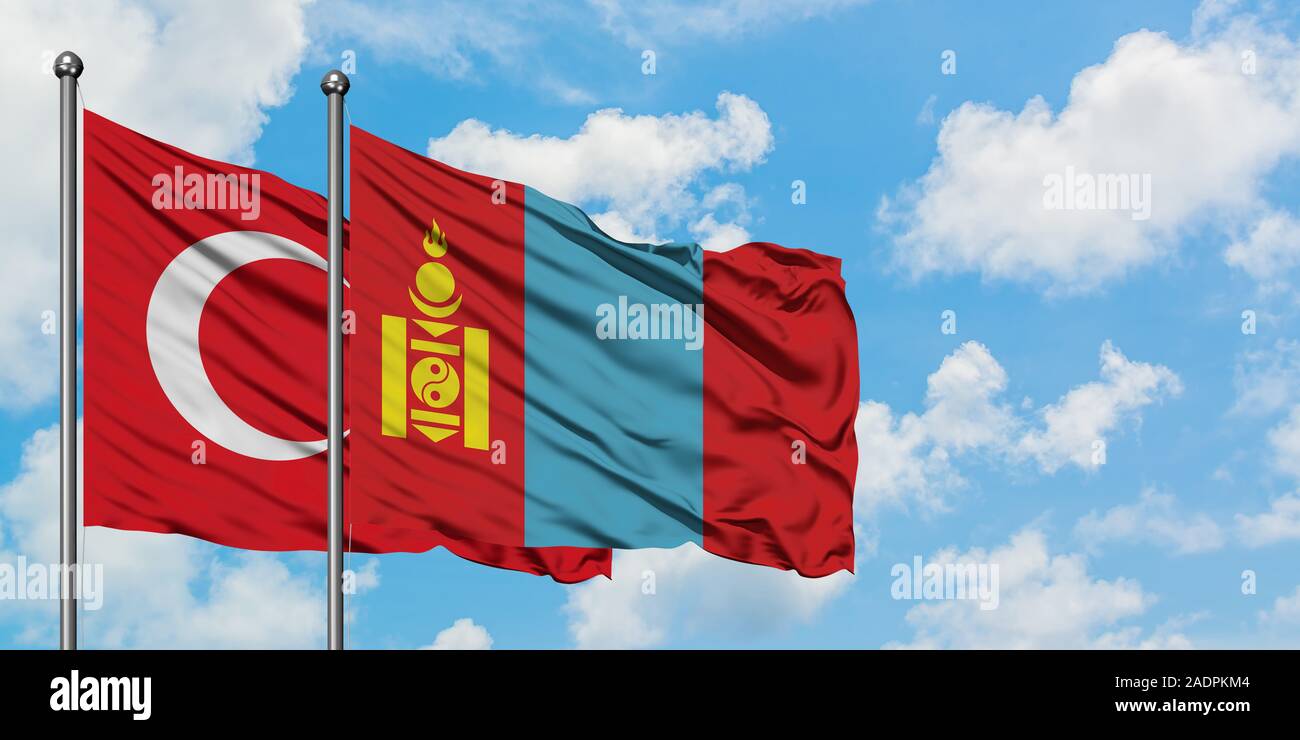 Turkey and Mongolia flag waving in the wind against white cloudy blue ...