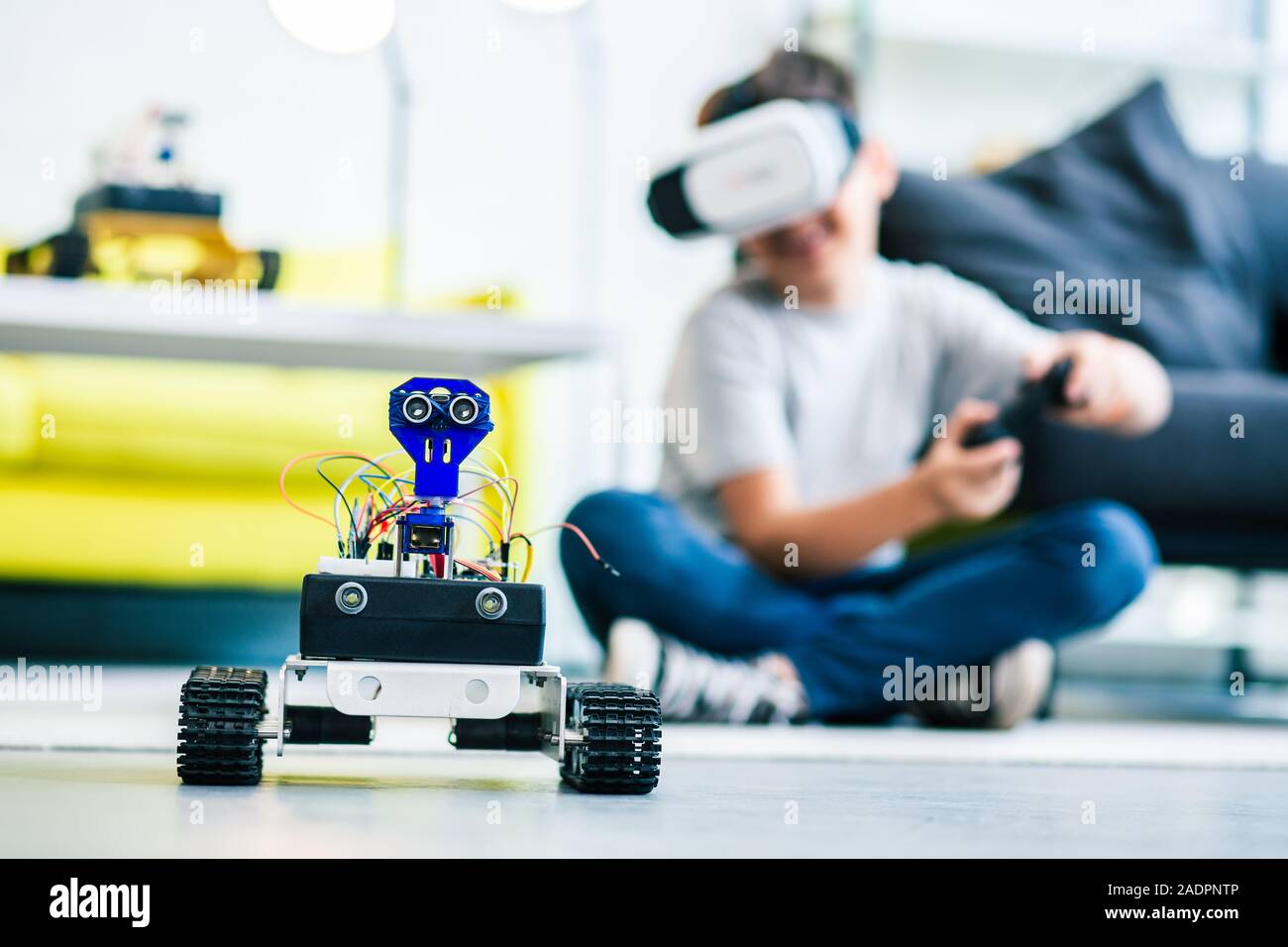 Selective focus of a modern robot on the floor Stock Photo - Alamy